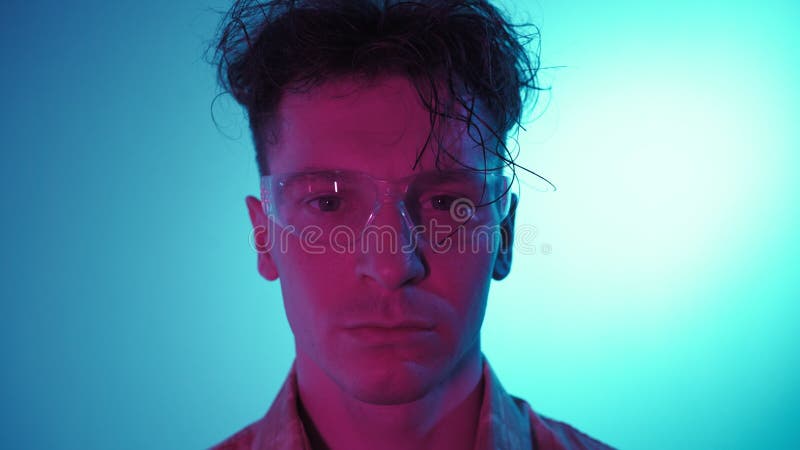 Portrait Serious Man Looking at Camera in Neon Lighting. Guy in Trendy ...