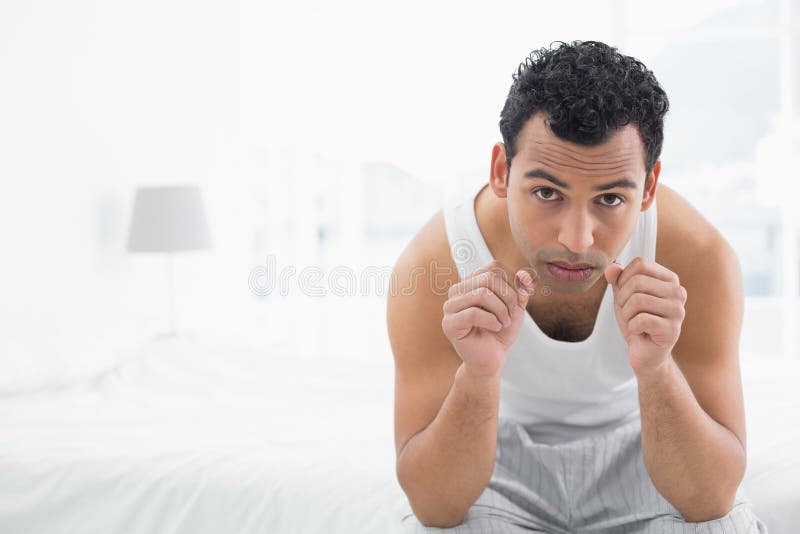 Portrait of a Serious Man Sitting on Bed Stock Image - Image of life ...