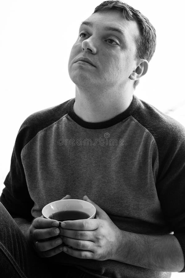 Portrait of Serious Young Man with Cup of Tea Stock Photo - Image of ...