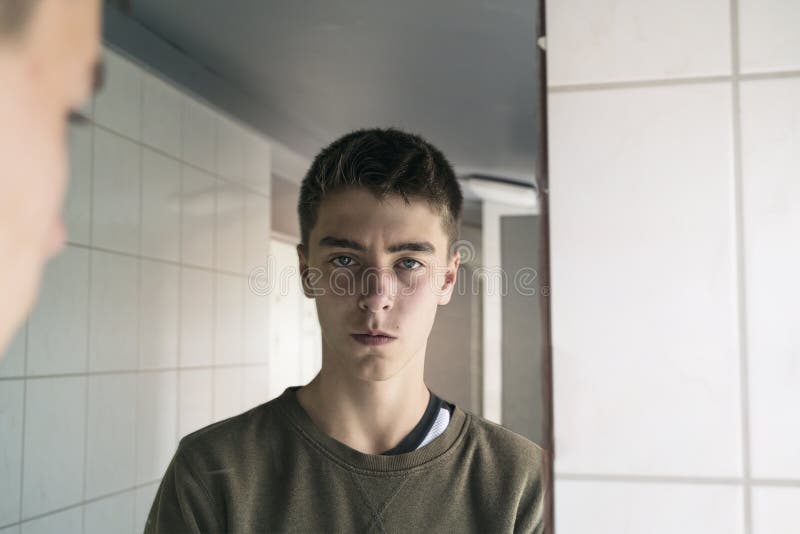 Serious Young Man in a Mirror Stock Photo - Image of mirroring ...