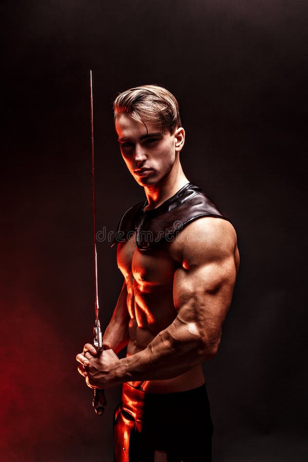 Portrait of Muscular Man Holding Sword Stock Photo - Image of clothes ...