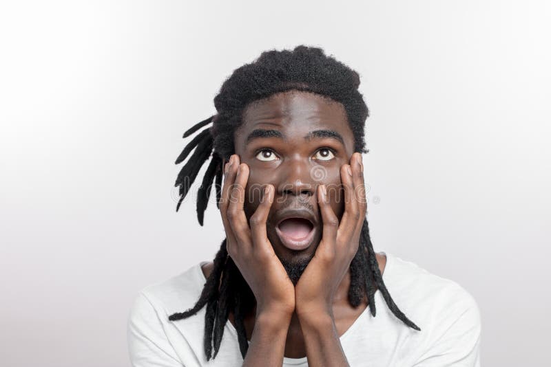 Shocked African American Man Wearing White T Shirt Looking At Camera In