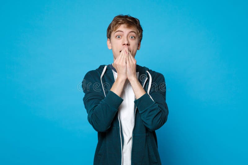 Portrait Of Shocked Amazed Young Man In Casual Clothes Standing