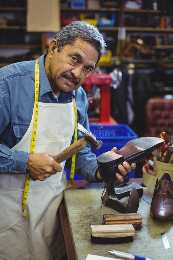 Portrait of Shoemaker Hammering on a Shoe Stock Photo - Image of ...