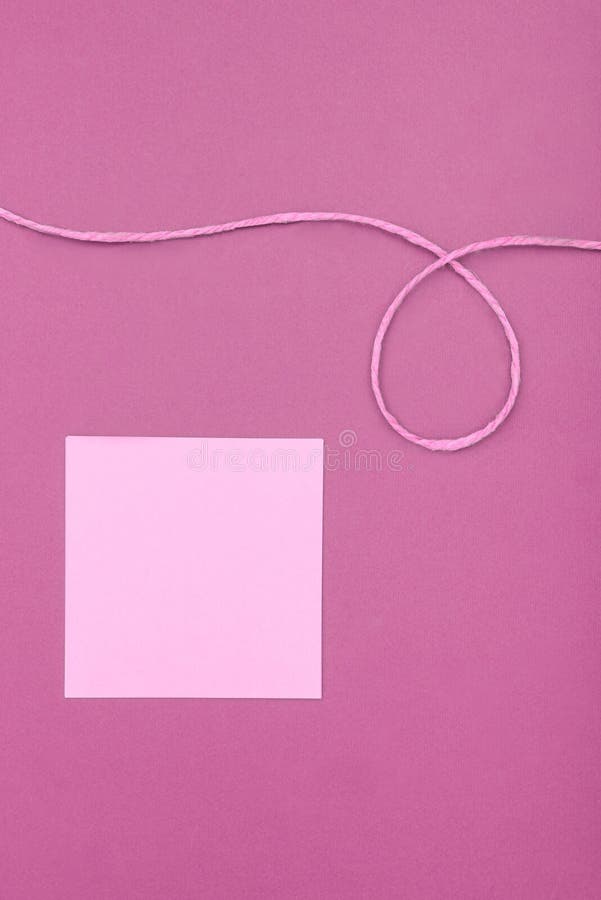 Portrait Shot of a Pink Post-it Note and a Matching Pink String on a ...