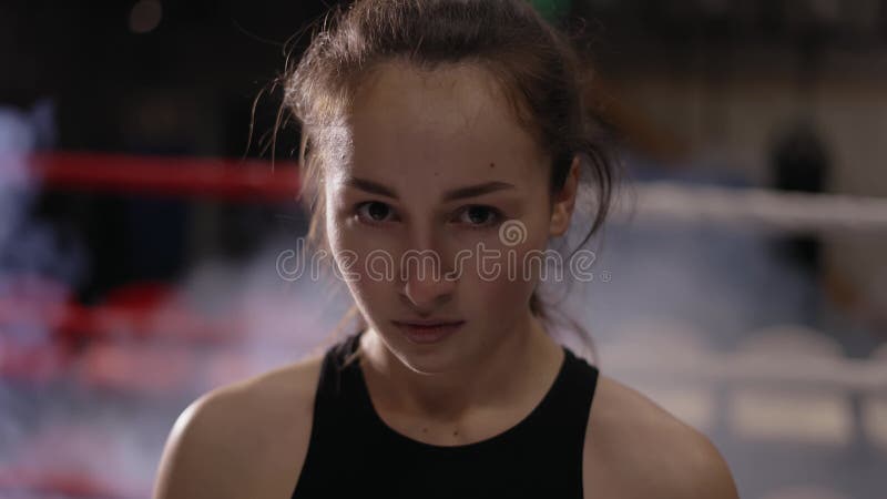 Portrait Shot of Pretty Female Fighter with Wrapped Hands Looking at ...