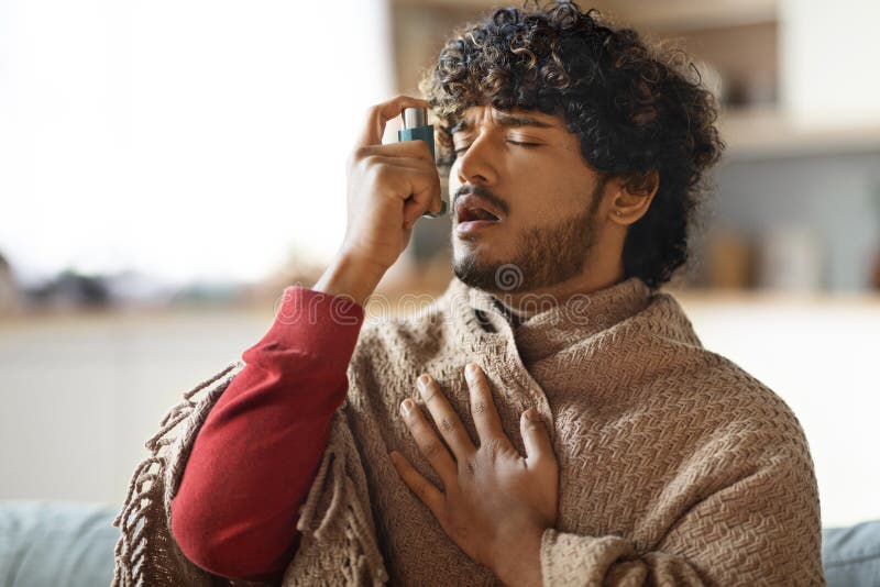 Portrait of Sick Young Indian Man Using Inhaler at Home Stock Image ...