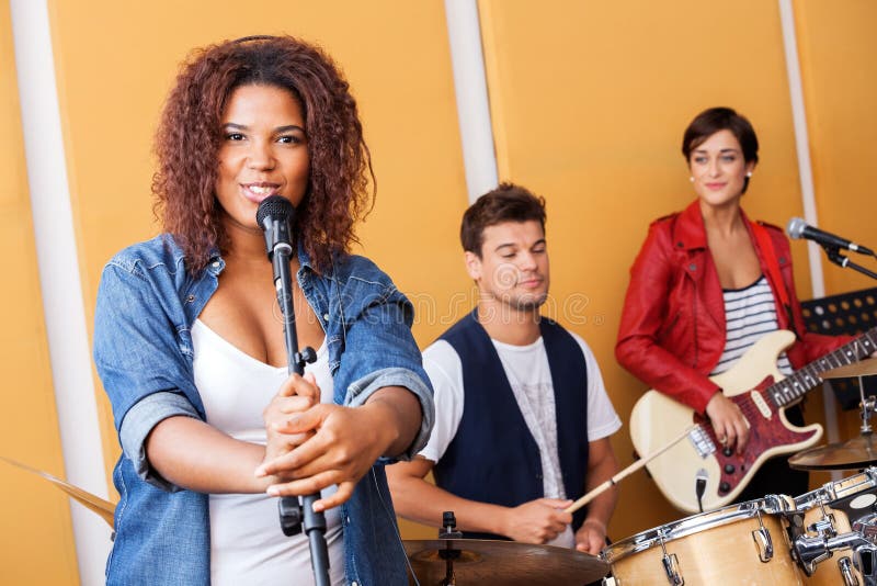 Portrait of Singer Performing with Band in Stock Photo - Image of ...