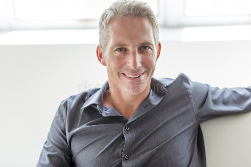 Portrait of Single 40s Man Sitting in Sofa Stock Photo - Image of ...