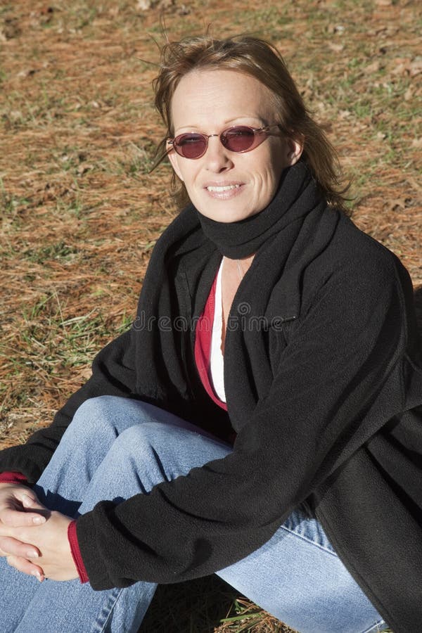 Portrait sitting on grass stock image. Image of smile - 7601113