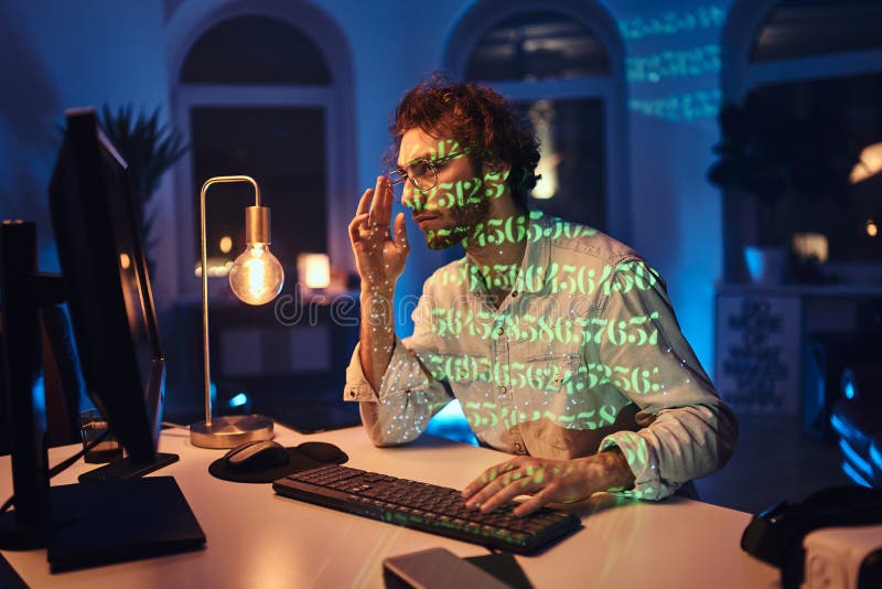 Professional Programmer Doing His Job on Computer in Dark Office Stock ...