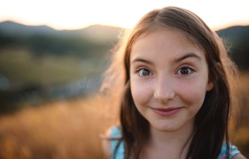 A Portrait of Small Girl in in Nature, Looking at Camera. Stock Image ...