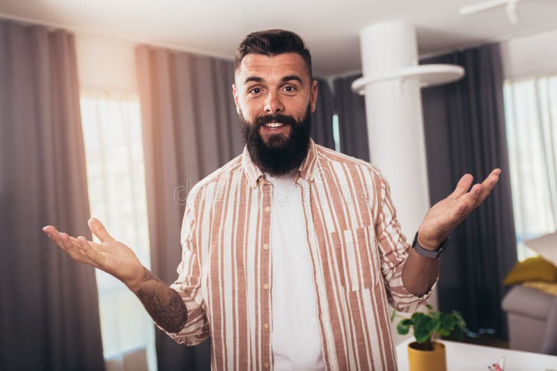 Smart Confident Smiling Millennial Man Standing at Home Stock Photo ...