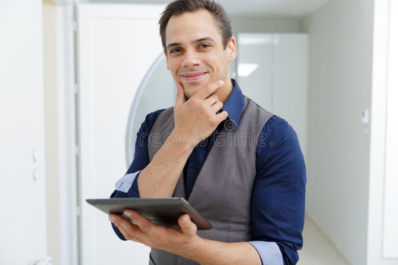 Portrait Smart Man Holding Tablet Hand on Chin Stock Photo - Image of ...