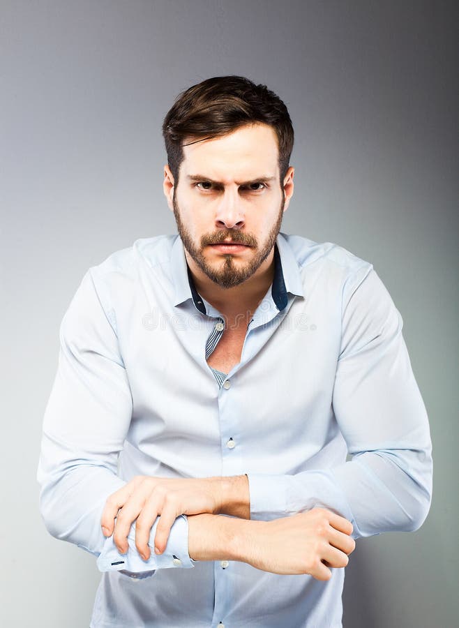 Portrait of a Smart Serious Young Man Standing Stock Photo - Image of ...