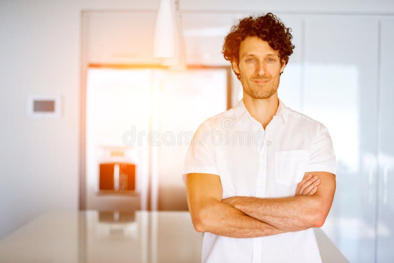Portrait of a Smart Young Man Standing in Kitchen Stock Photo - Image ...