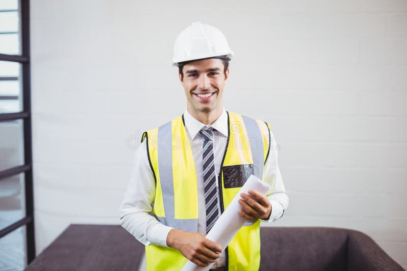 Construction Engineer Wearing White Hard Hat and Yellow Safety Vest ...