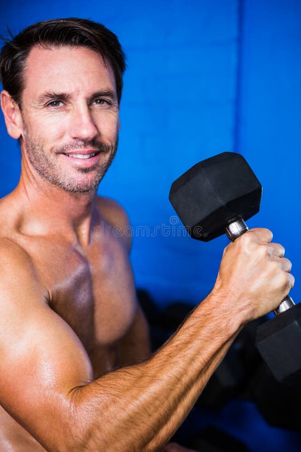 Portrait of Smiling Athlete Lifting Dumbbell Stock Photo - Image of ...