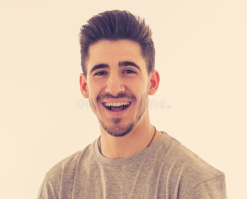 Portrait Of Smiling Attractive Cheerful Young Man Face In Human Facial