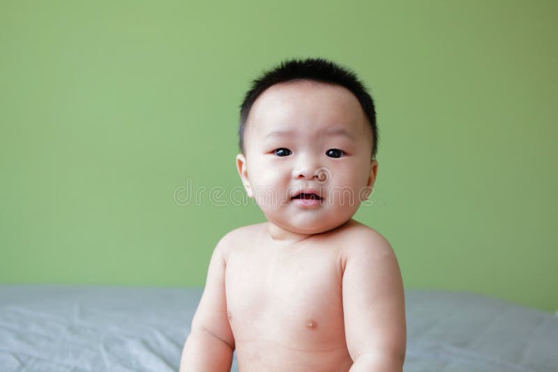 Portrait of Smiling Baby with Green Background Stock Photo - Image of ...