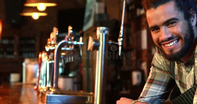 Portrait of Smiling Barman Leaning at Bar Counter Stock Video - Video ...