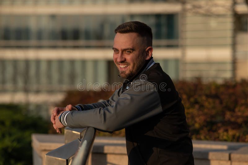 Portrait of a Smiling Bearded Man Outdoors at Sunset. Stock Image ...