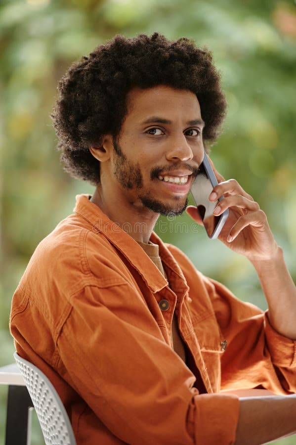 Smiling Black Man Calling stock photo. Image of client - 294400912