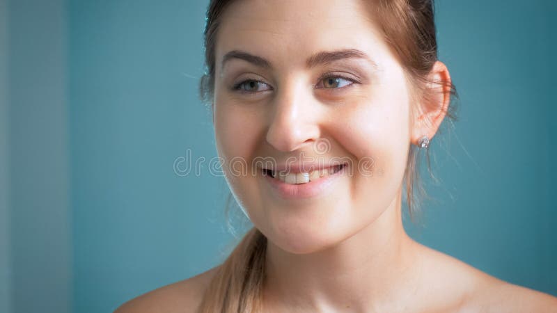 Portrait Of Beautiful Smiling Brunette Woman Looking At Herself In