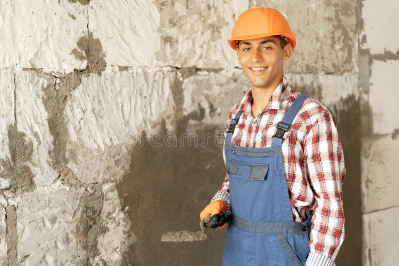 Portrait of Smiling Builder Worker Plasterer Holding Trowel To ...