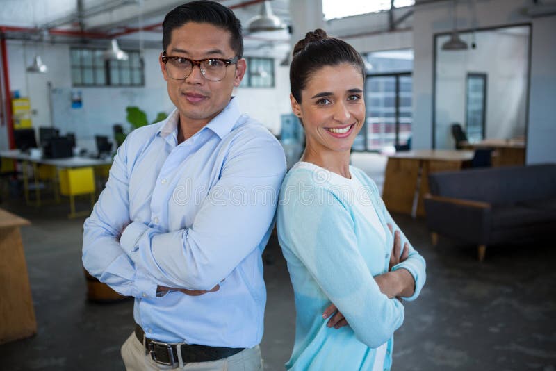 Portrait of Smiling Business Colleagues Standing Back To Back Stock ...