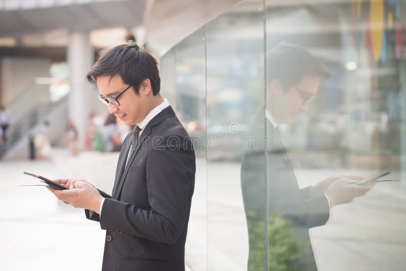 Portrait of Smiling Business Man Look Confident Using Computer Tablet ... Portrait of Smiling Business Man Look Confident Using Computer Tablet ...