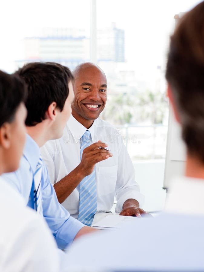 Multi-ethnic Business Team at a Meeting Stock Photo - Image of board ...