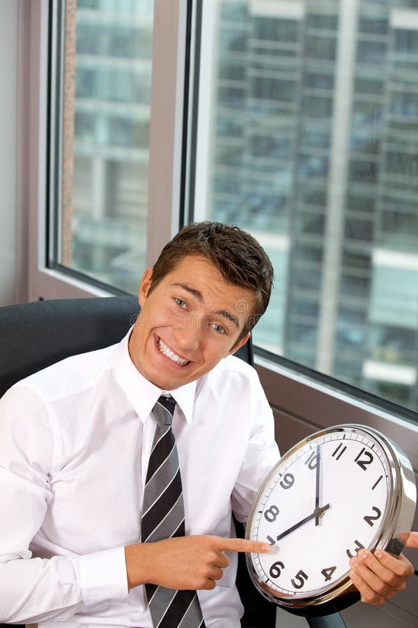 Portrait of Smiling Businessman Pointing at a Clock Stock Image - Image ...