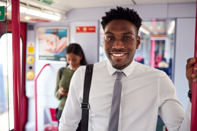 Portrait of Smiling Businessman Standing in Train Commuting To Work ...