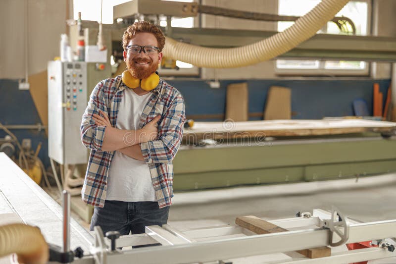 Portrait of Smiling Carpenter in Eyeglasses Standing on the Background ...