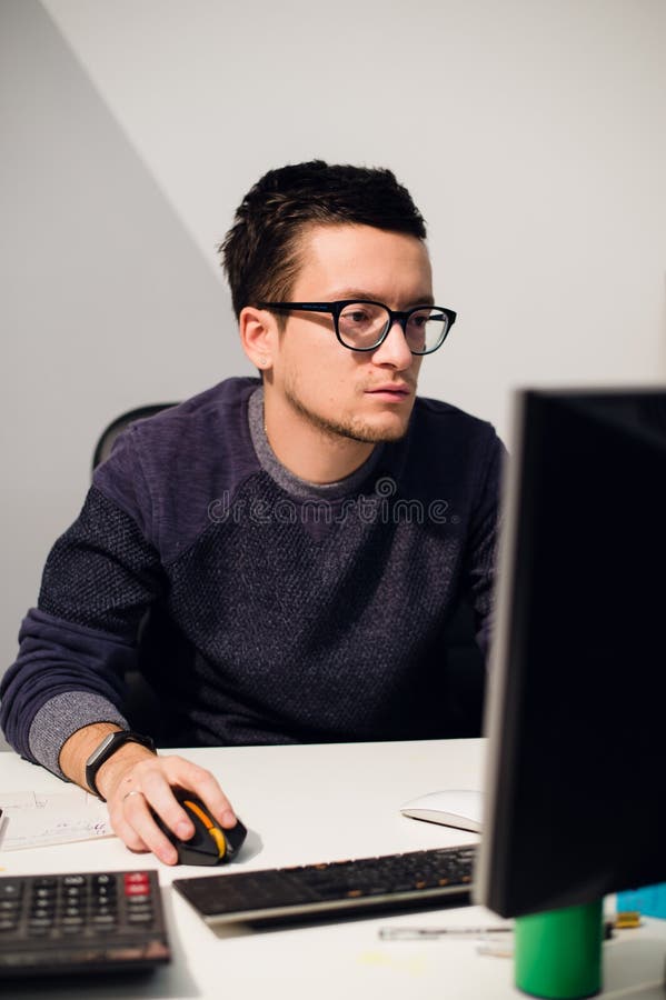 Portrait of Smiling Casual Businessman Working with Computer in the ...