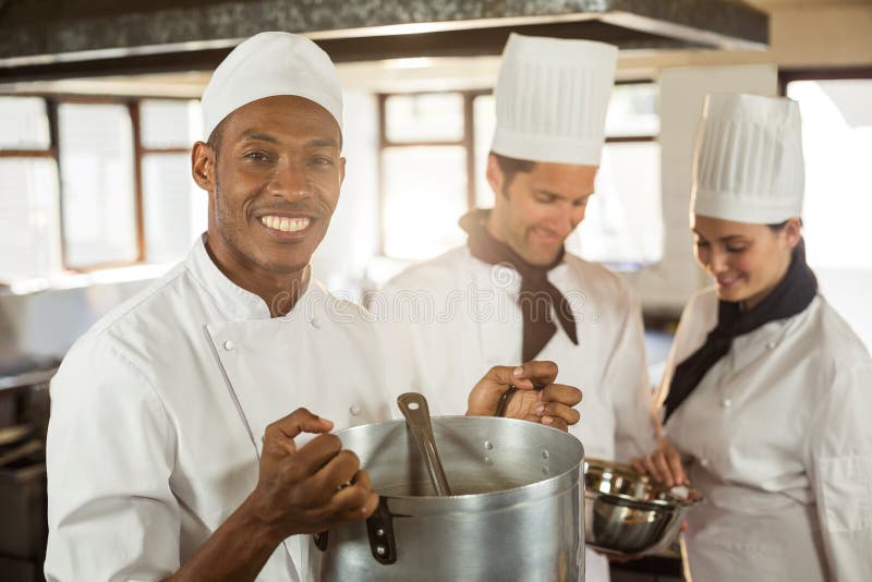 Portrait of Smiling Chef Holding a Cooking Pot Stock Photo - Image of ...