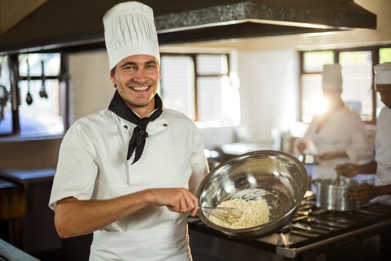 Portrait of Smiling Chef Mixing Dough Stock Image - Image of focus ...