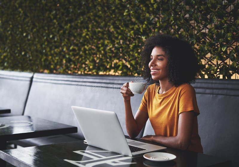 Smiling Confident Young Woman Sitting in Cafe with Laptop on Table ... Smiling Confident Young Woman Sitting in Cafe with Laptop on Table ...