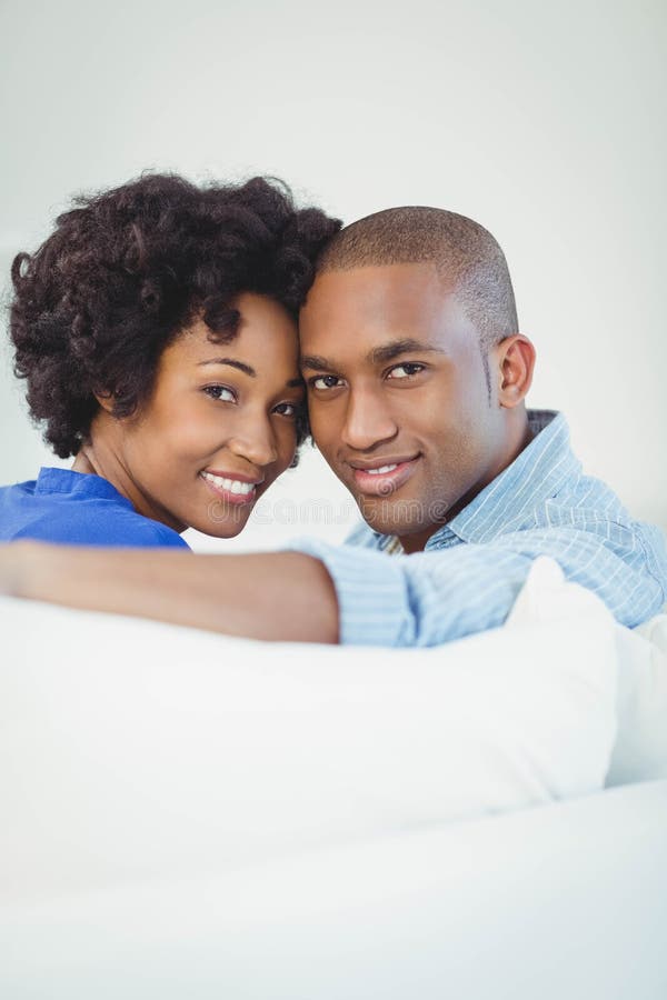Portrait of Smiling Couple on the Sofa Stock Image - Image of female ...