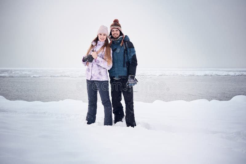 Portrait of Smiling Couple Standing on Ice Stock Photo - Image of ...