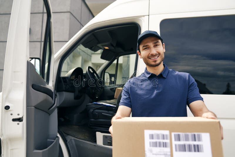 Delivery man at work stock photo. Image of professional - 224811602