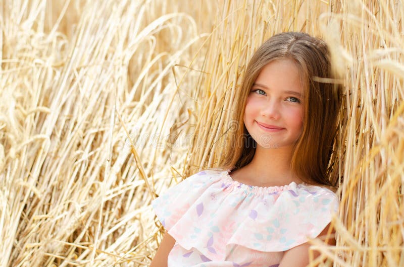 Portrait Of Smiling Cute Little Girl Child On Field Of Wheat Stock ... Portrait Of Smiling Cute Little Girl Child On Field Of Wheat Stock ...