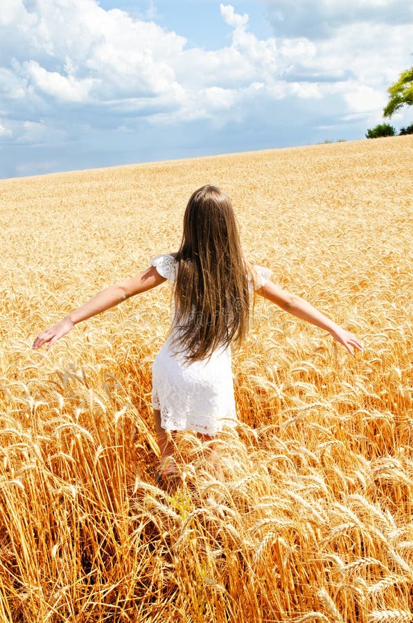Portrait of Smiling Cute Little Girl Child Running through Field of ... Portrait of Smiling Cute Little Girl Child Running through Field of ...