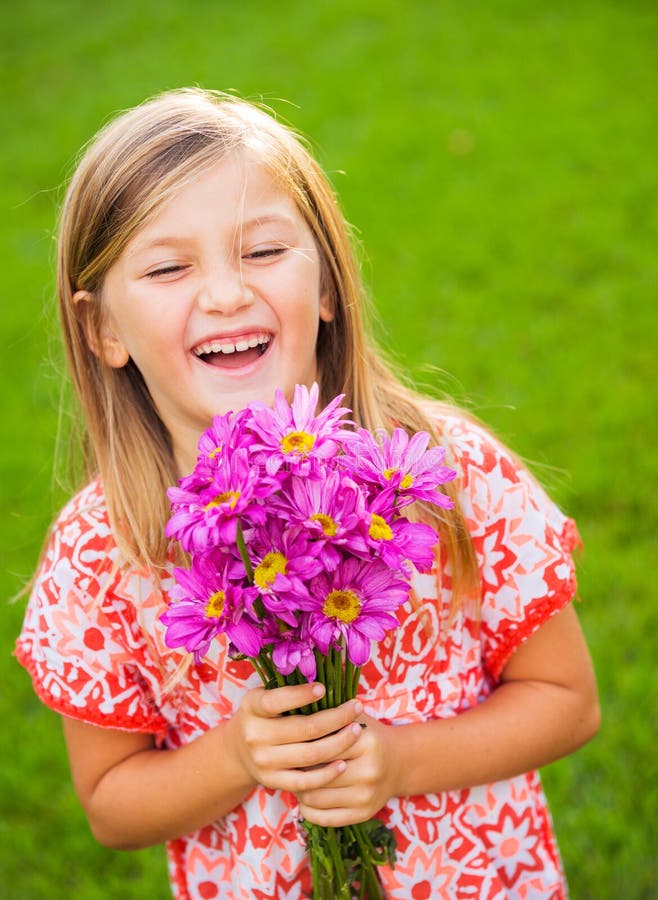 Portrait of a Smiling Cute Little Girl with Flowers Stock Photo - Image ... Portrait of a Smiling Cute Little Girl with Flowers Stock Photo - Image ...
