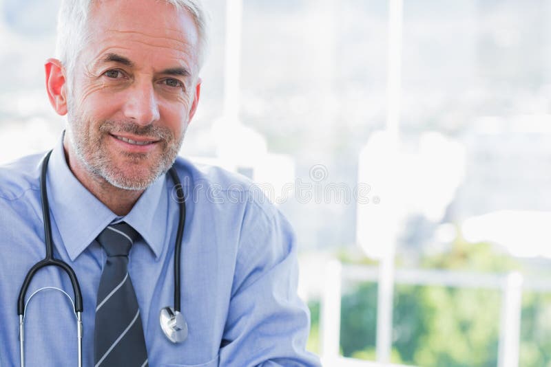 Portrait of a Smiling Doctor Stock Photo - Image of male, indoors: 31553498