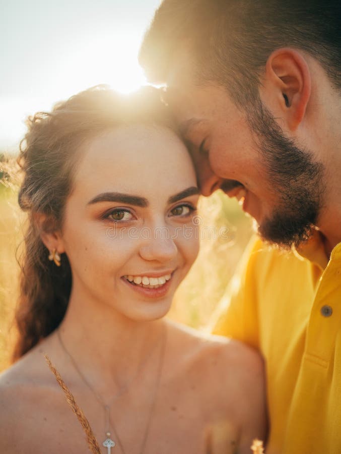 Portrait of Smiling Enamored Couple at Meadow. Stock Photo - Image of ...