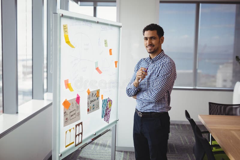 Portrait of Smiling Executive Standing Near Whiteboard Stock Image ...