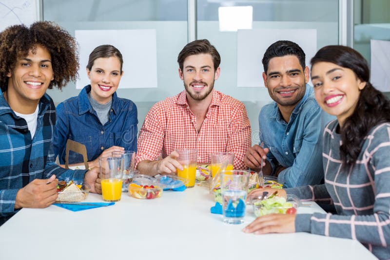 Portrait of Smiling Executives Having Breakfast Stock Image - Image of ...
