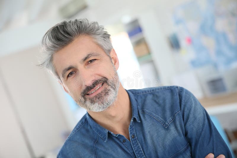 Portrait of Smiling Experienced Professor in Class Stock Photo - Image ...